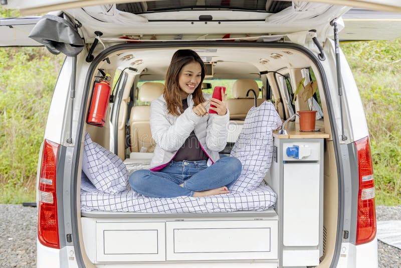 Asian Woman Using Mobile Phone Inside the Campervan Stock Image - Image ...