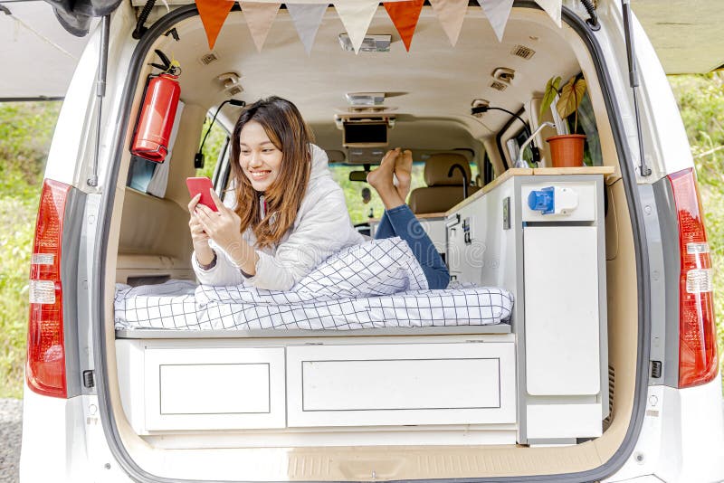 Asian Woman Using Mobile Phone Inside the Campervan Stock Image - Image ...