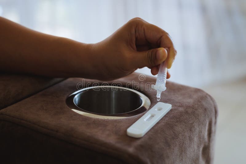 Asian Woman Using Rapid Antigen Test Kit for Self Testing COVID-19 at ...