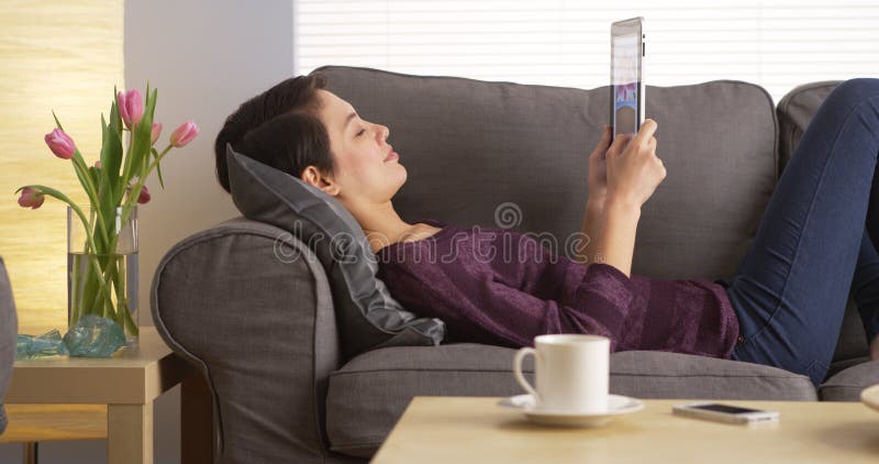 Asian Woman Using Tablet on Sofa Stock Image - Image of happiness ...
