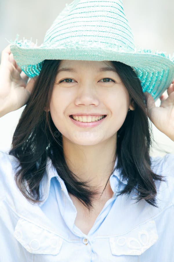 Asian Woman Wearing a Blue Hat with Smiling Face Stock Photo - Image of ...