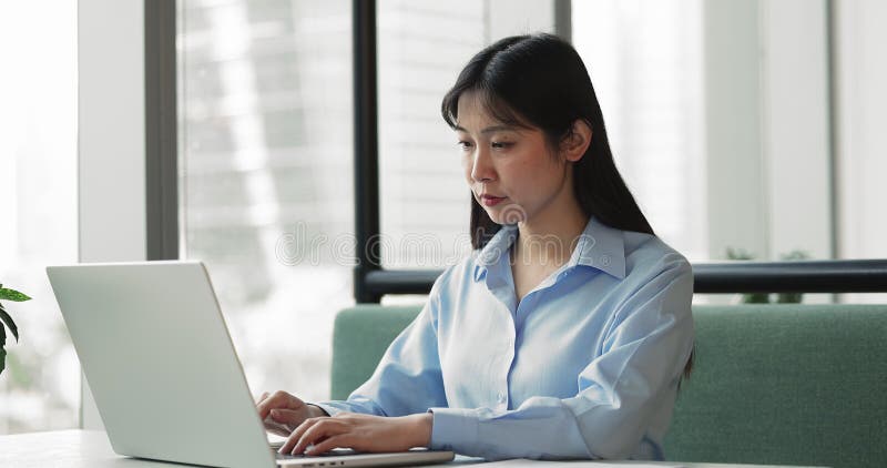 Asian Woman Typing or Editing Document Using Laptop Stock Video - Video ...
