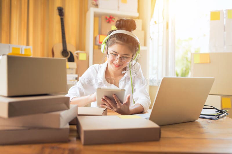 Asian Women Buying Goods Online through Computer and Cell Phone Stock ...
