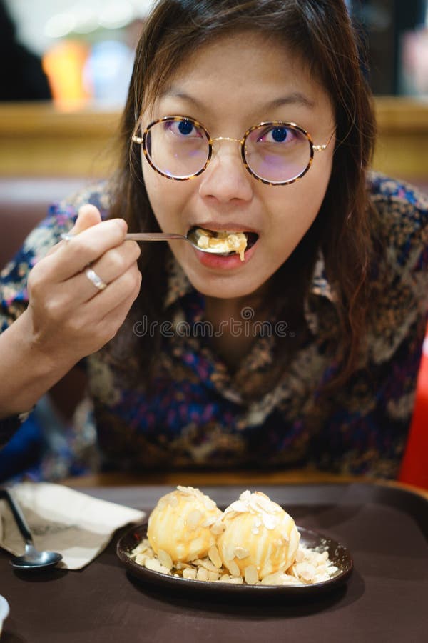 Asian Women Eating Vanilla Ice-cream Stock Photo - Image of vanilla ...