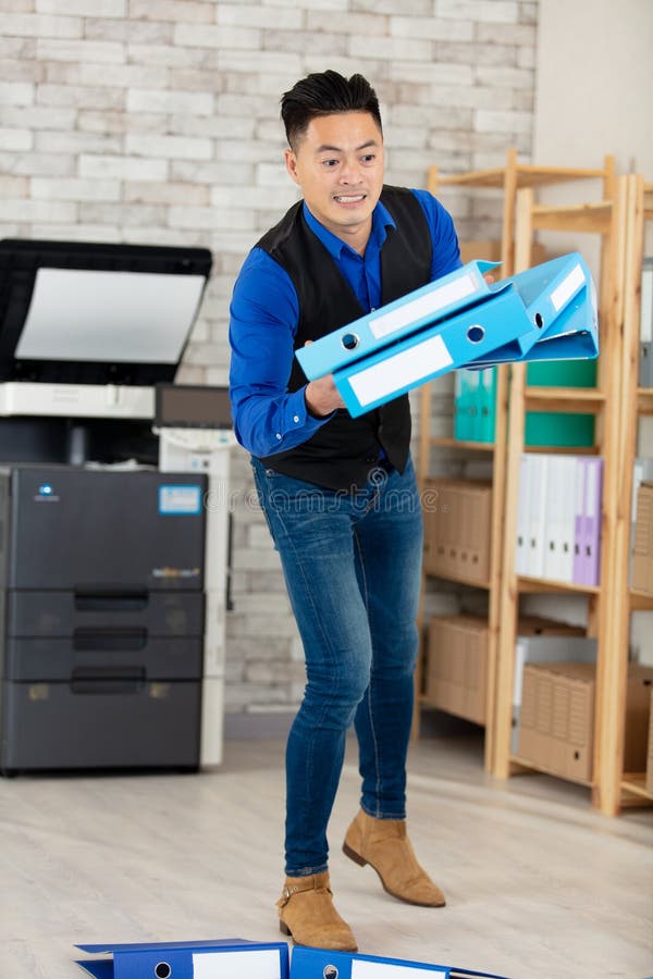 Asian Worker Carrying Files Falling Stock Image - Image of warning ...