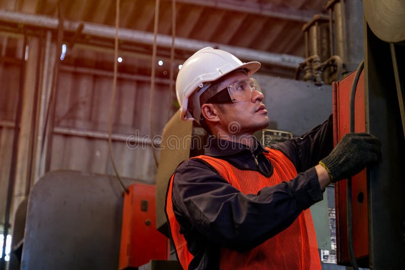 Asian Worker or Technician Works with Machine in Factory Stock Image ...