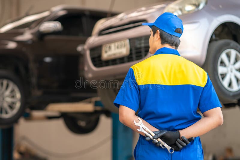 Asian Worker in Uniform Working in Car Engine Stock Image - Image of ...