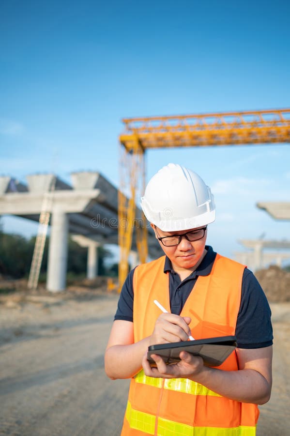 Asian Worker Using Digital Tablet at Construction Site Stock Image ...