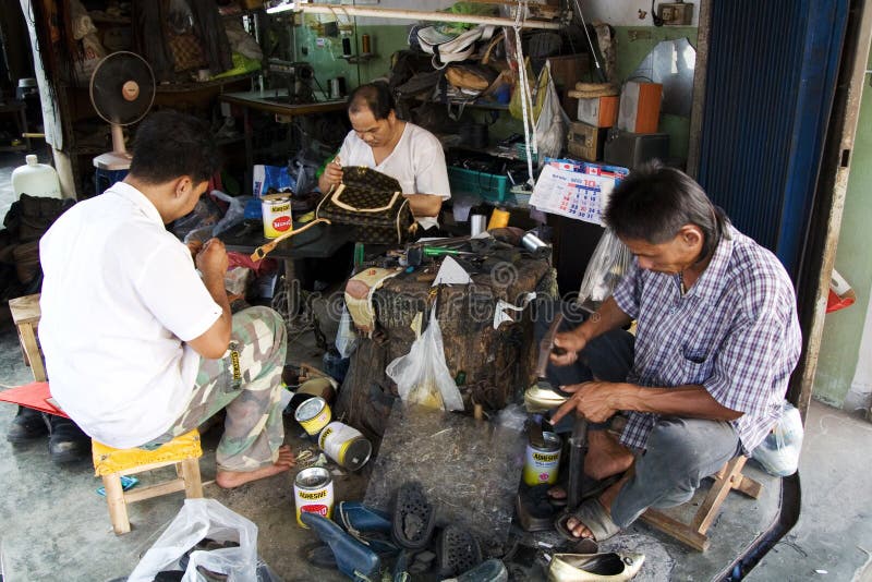 Asian Workers In Dubai. A Group Of Asian Workers At The Construction ...