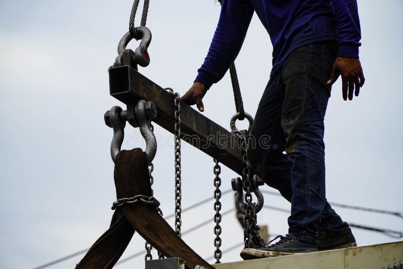 Asian Workers Install Chain Hooks To Connect Elements of Crane: Hook ...