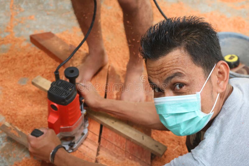 Asian Workers Using Electric Routering Cut the Wood and Sawdust Stock ...