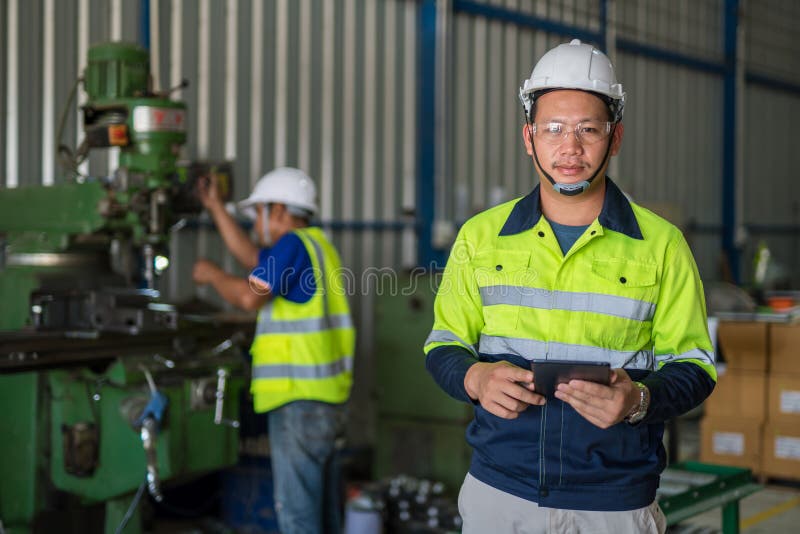 Asian Young Engineer Checking Worker Operating Lathe Grinding Machine ...