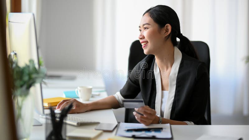 Female Entrepreneur Checking Her Stocks on Desktop Computer Stock Photo ...