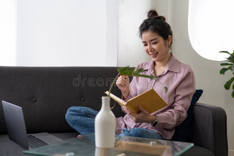 Asian Young Female Using Laptop Listen and Learning Online Courses at ...