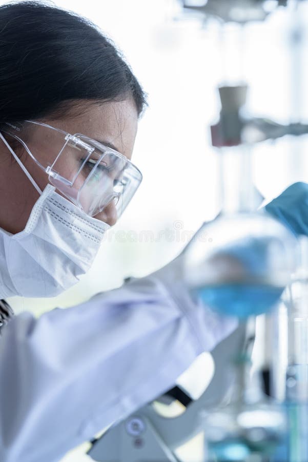 Asian Young Girl Student Scientist Researching and Learning in a ...