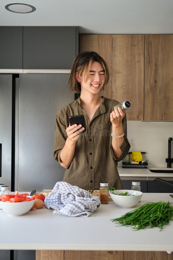 Asian Young Man Checking Recipe Ingredients on Mobile Phone at Kitchen ...