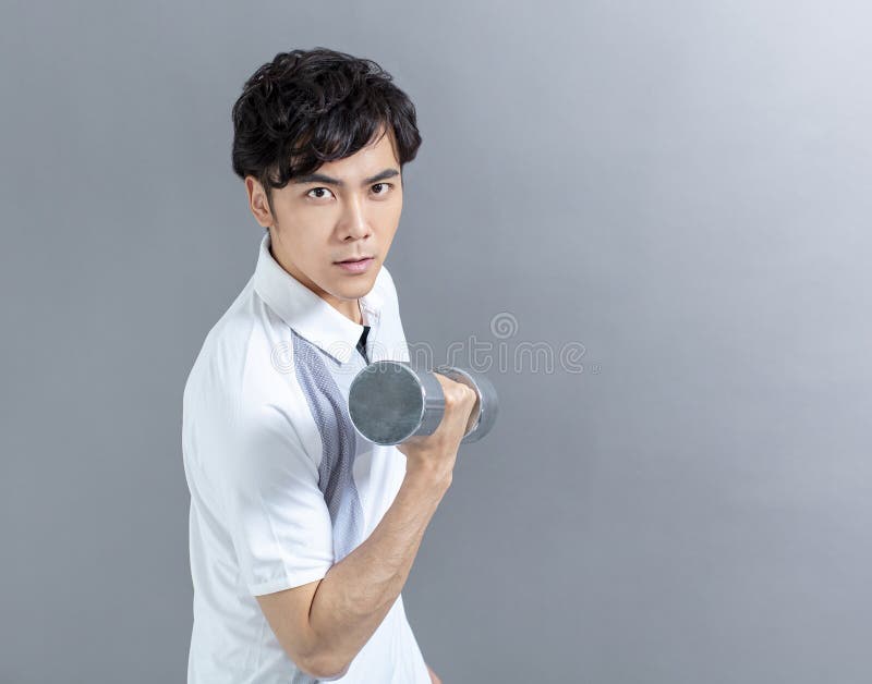 Asian Young Man Doing Exercise with Dumbbell Stock Image - Image of ...
