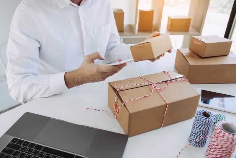 Asian Young Man Using Smart Phone for Checking Shipment Order at Home ...