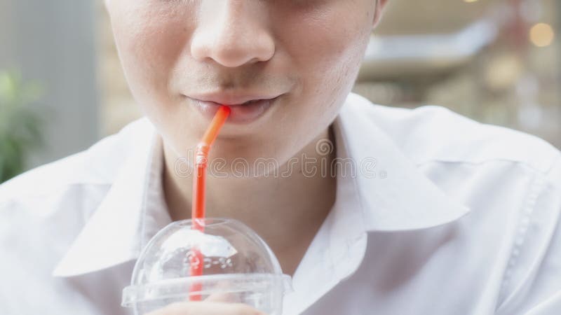 Asian Young Man Using a Straw To Drink Stock Photo - Image of black ...