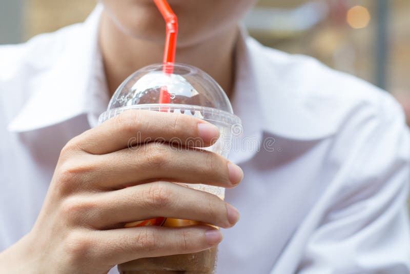 Asian Young Man Using a Straw To Drink Stock Photo - Image of beverage ...