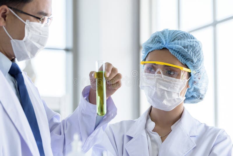 Asian Young Student Scientist Researching and Learning with Senior ...