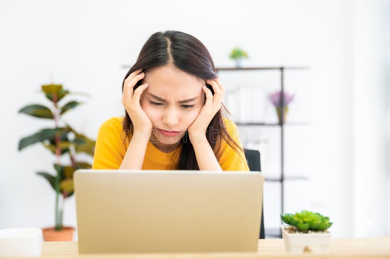 Asian Young Woman Seriously Working on Computer Laptop in House Stock ...