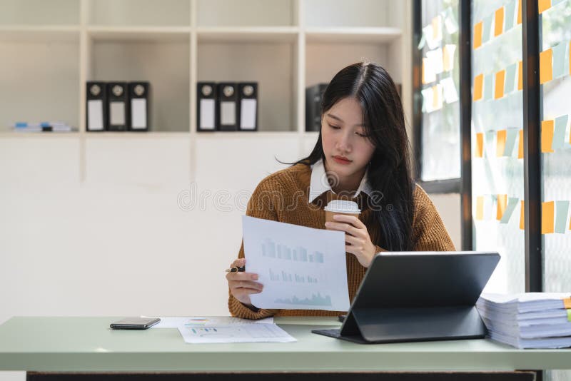 Asian Young Woman Seriously Working on Computer Laptop in House. she ...