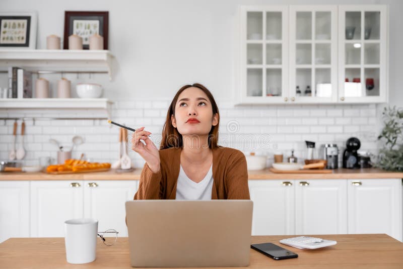 Asian Young Woman Seriously Working on Computer Laptop in House Stock ...