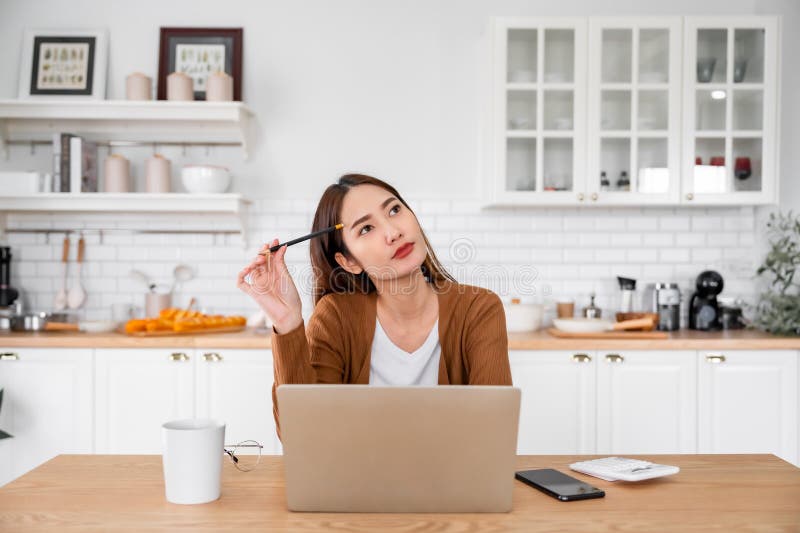 Asian Young Woman Seriously Working on Computer Laptop in House Stock ...