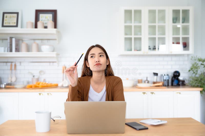 Asian Young Woman Seriously Working on Computer Laptop in House Stock ...