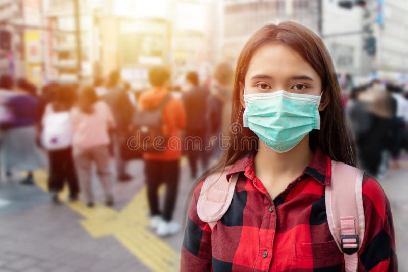 Asian Young Woman Walking In The City Wearing Protection Mask On Face