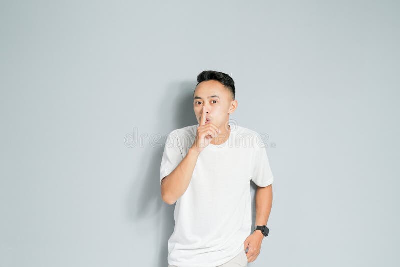 An Asian Youth is Making a Silent Gesture Stock Image - Image of firm ...