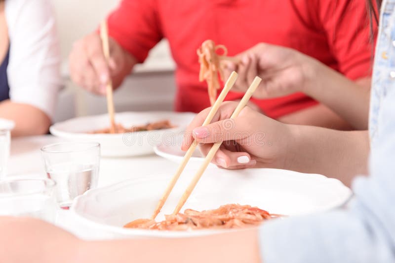 Asians eating with sticks stock image. Image of lunch - 54779425