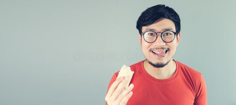 Asiatischer Mann isst stockfoto. Bild von sandwich, hintergrund - 60169730