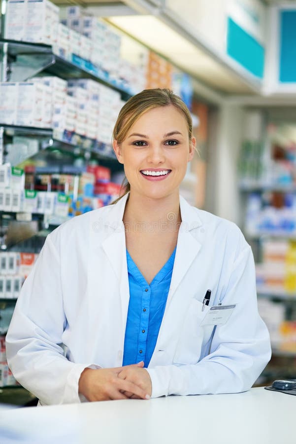 Ask Me, Im a Pharmacist. Portrait of a Happy Young Woman Working in a ... Ask Me, Im a Pharmacist. Portrait of a Happy Young Woman Working in a ...
