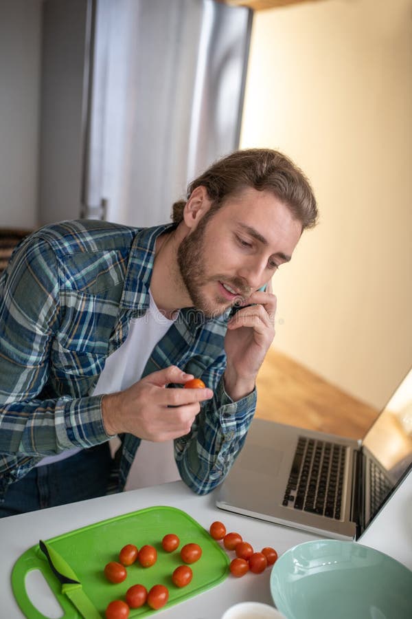 Man Calling His Mom for Asking Reccommendations about Cooking Stock ...