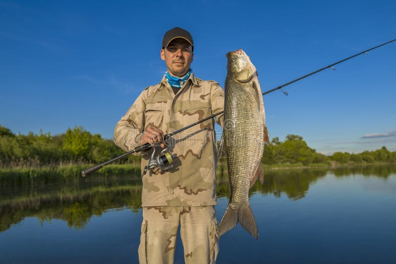 Asp Fishing. Fisherman with Big Aspius Fish Stock Image - Image of ...