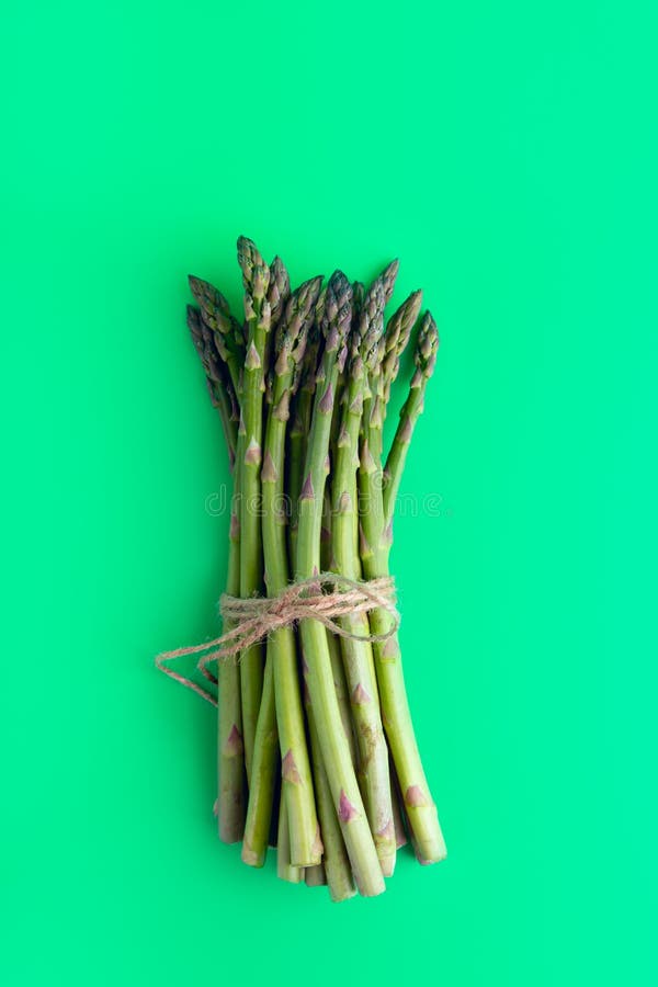 Asparagus on a Plain Green Background. View from Above. Color ...