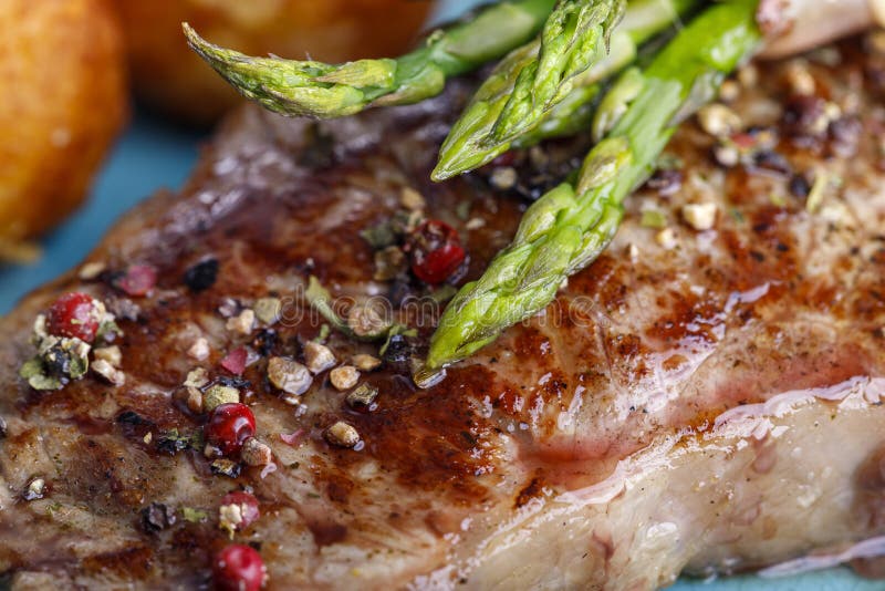 Asparagus on a steak stock photo. Image of french, dinner - 210723922