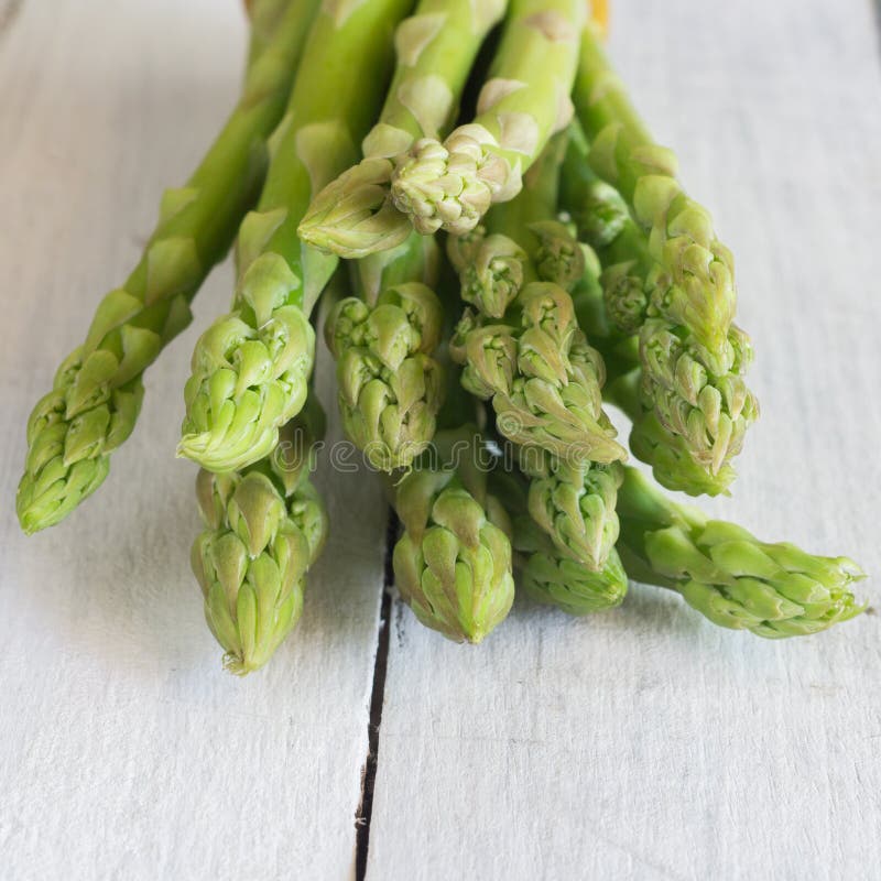 Asparagus on wooden table stock photo. Image of harvest - 53345048