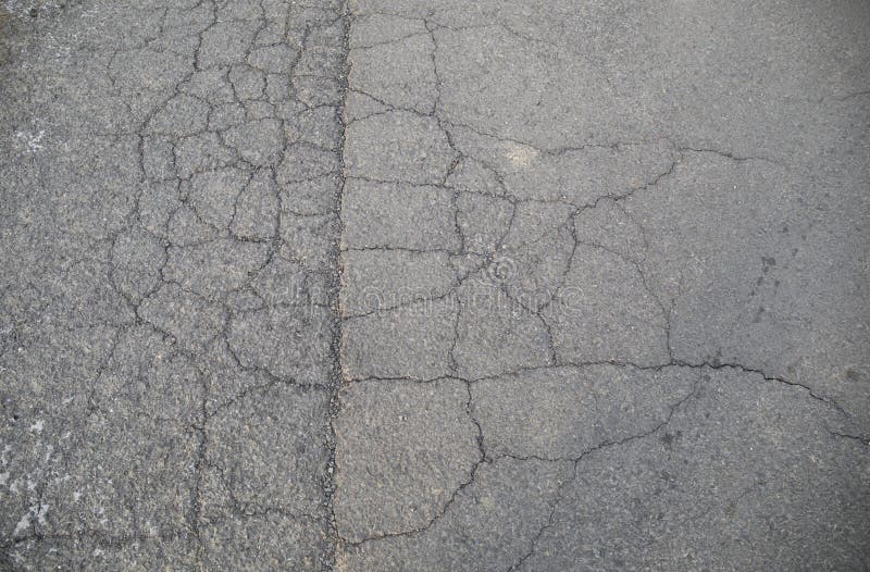 Asphalt with Cracks Radiating Across the Surface Stock Photo - Image of ...