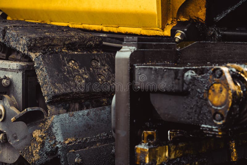Asphalt laying machines stock photo. Image of pieces - 117432478