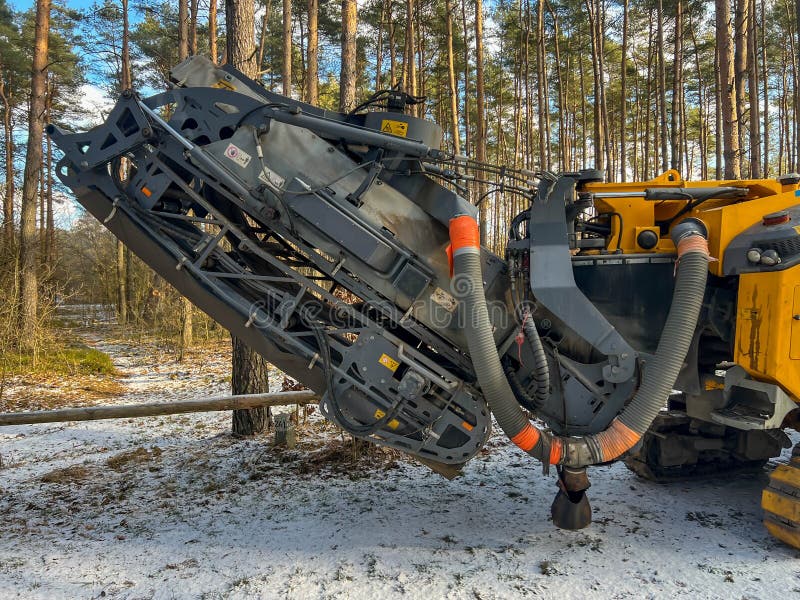 An Asphalt Milling Machine in a Parking Lot, Waiting To Remove Part of ...