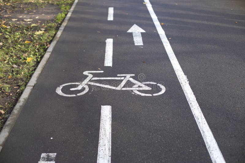 Asphalt Path with Markings for the Passage of Cyclists, a White Bicycle ...