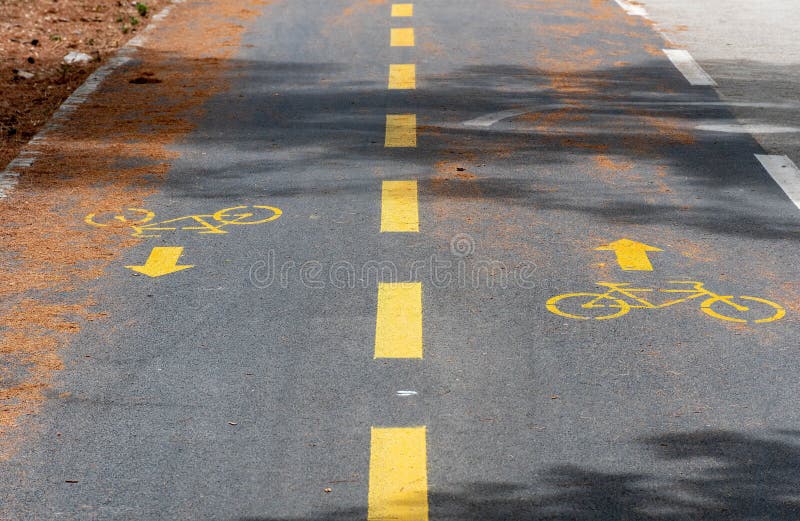 Asphalt Path with Yellow Bicycle Signs Stock Image - Image of icon ...