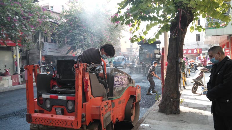 Shenzhen, China: Construction Machinery and Workers Work on the ...