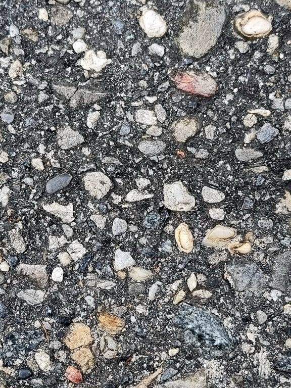 Asphalt Pavement with Various Sizes and Colors of Embedded Rocks and ...