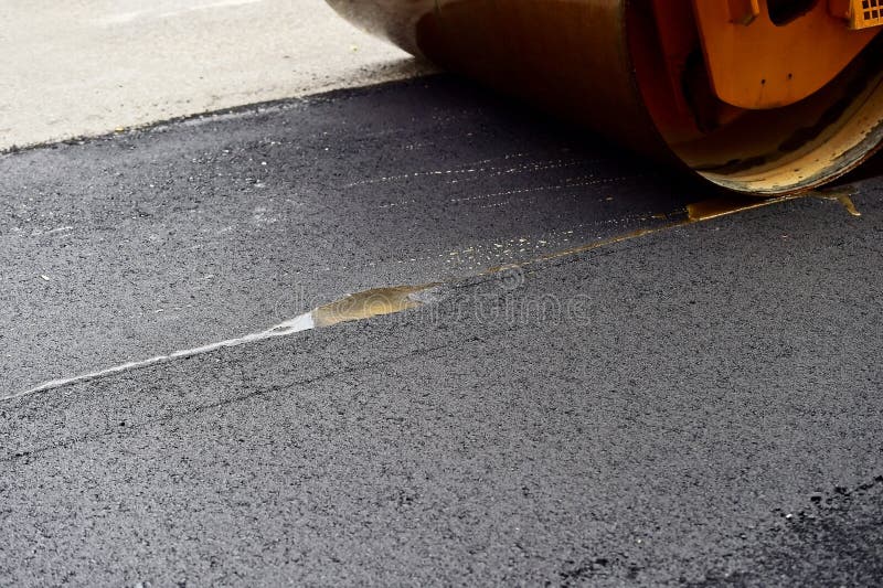 Asphalt Paving with a Steel Wheel Roller Stock Photo - Image of ...