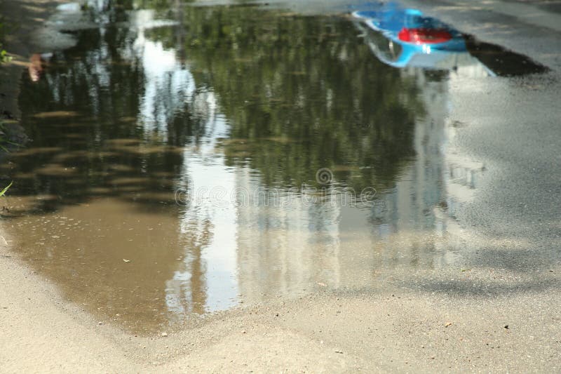 Asphalt with Puddle after Rain on Sunny Day Stock Photo - Image of ...