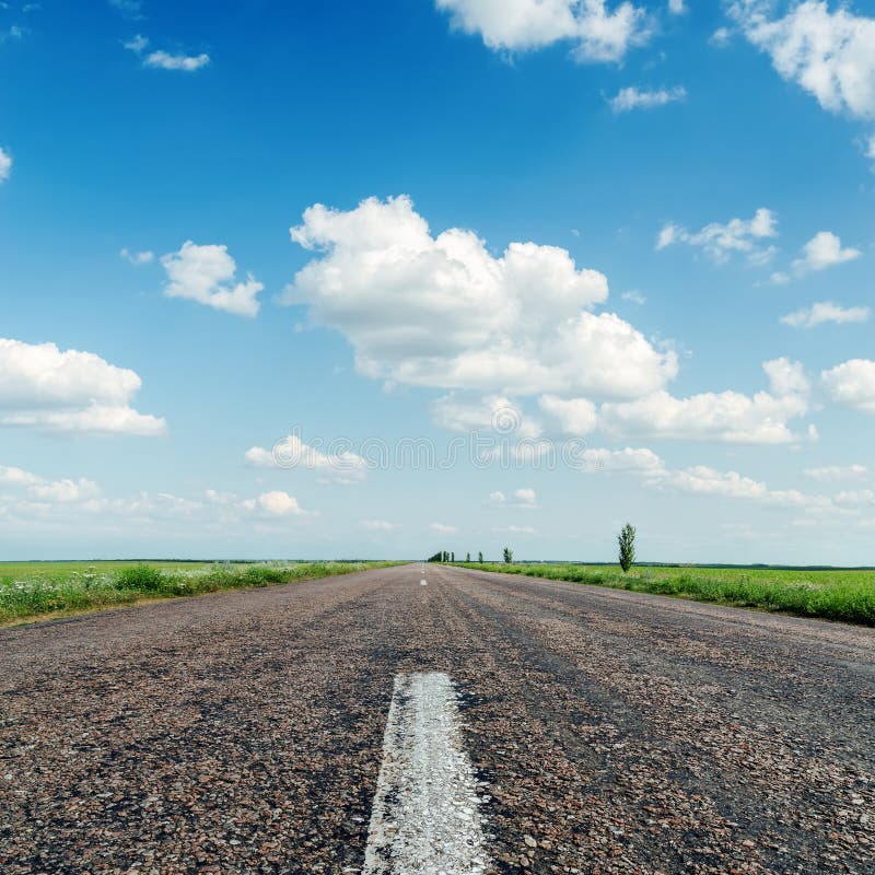 Asphalt Road Close Up Under Clouds Stock Photo - Image of field, bright ...